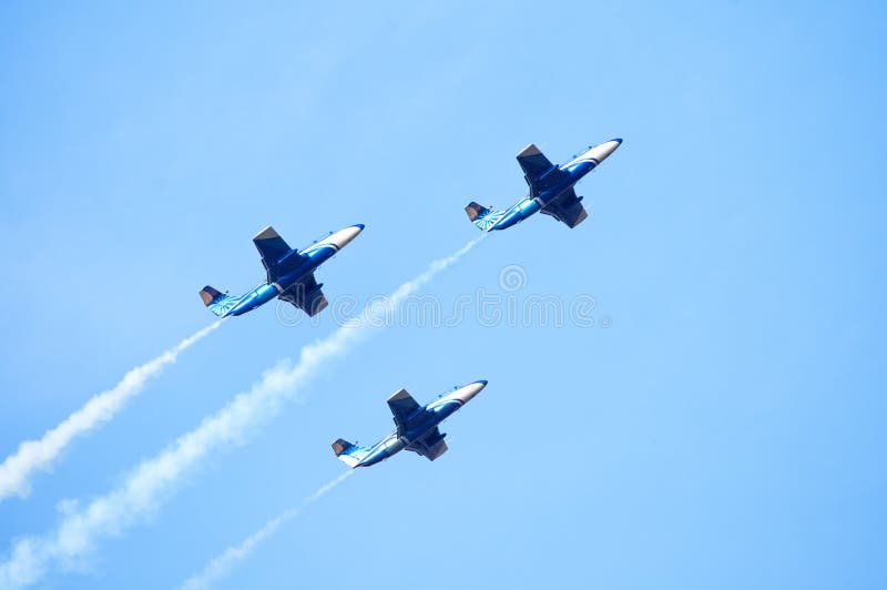 Three Jet Planes Producing Colored Smoke in the Sky Stock Photo - Image ...