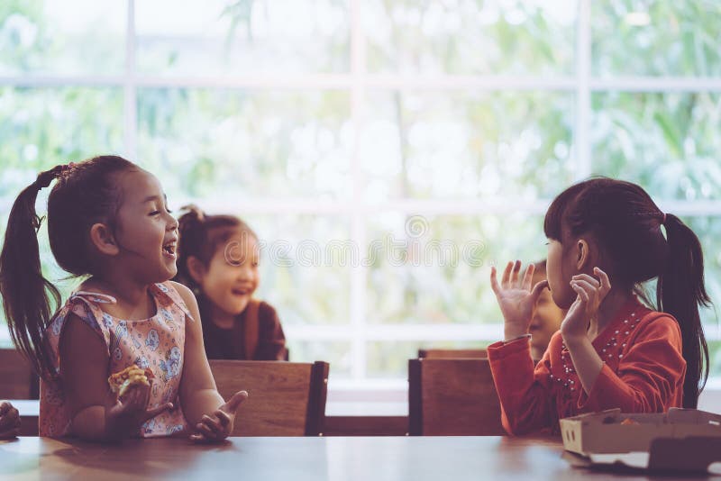 Three Kids Eating Delivery Pizza in Classroom Stock Image - Image of ...