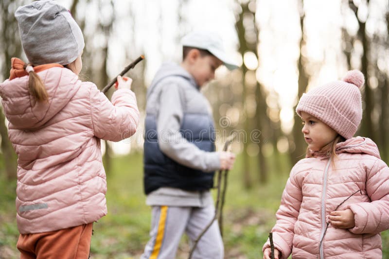 Three Kids Hiking and Discovering Spring Forest. Happy Childhood Stock ...