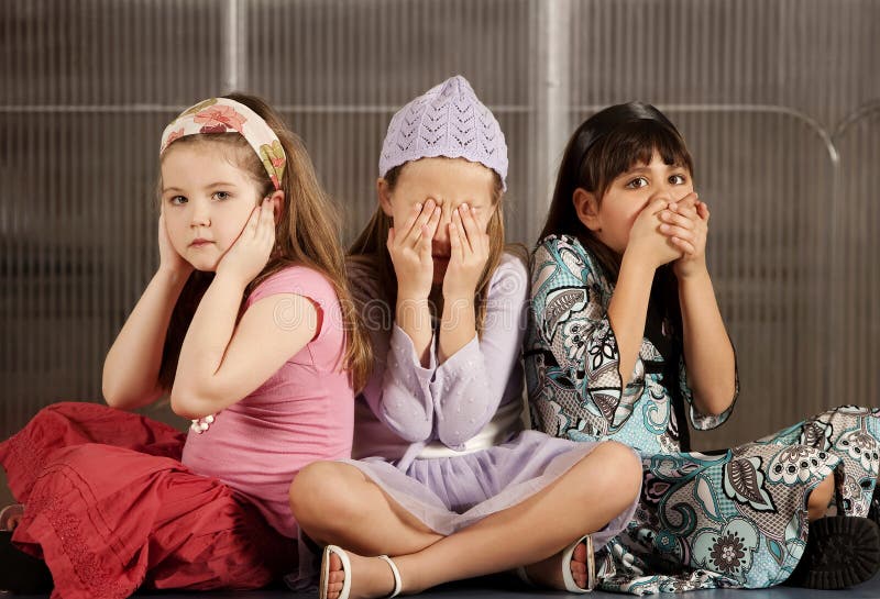 Three kids ignoring evil stock photo. Image of speak, pose - 8643974