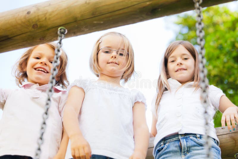 Three Kids Playing Outside stock image. Image of colors - 85667859
