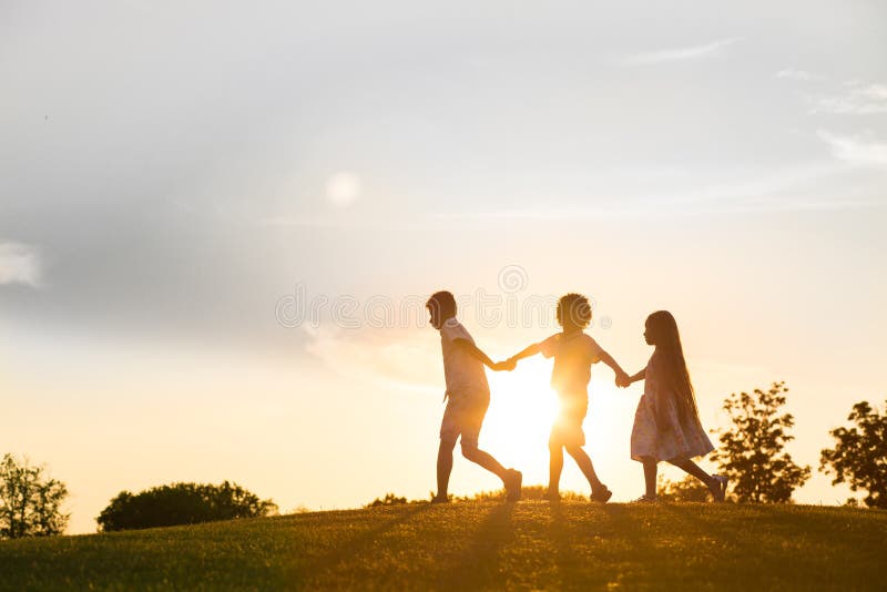 Three Kids are Playing on Sunset. Stock Photo - Image of park, outdoor ...
