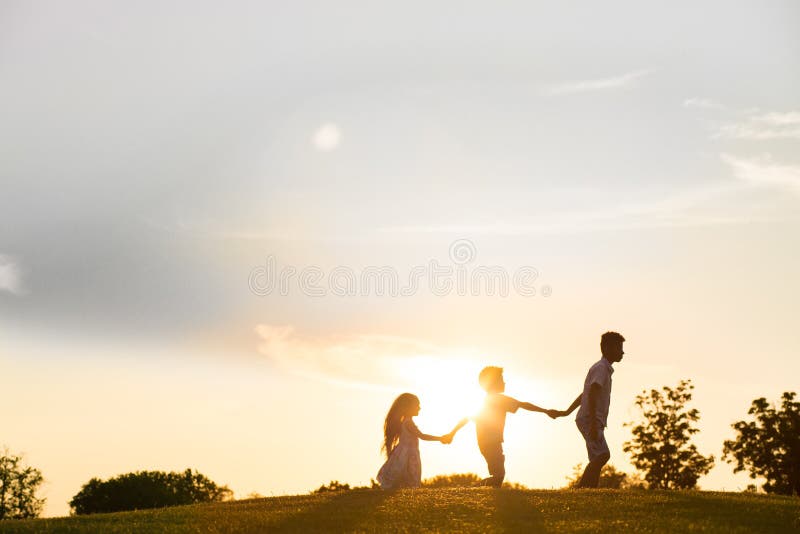 Three Kids are Playing on Sunset. Stock Image - Image of child, dress ...