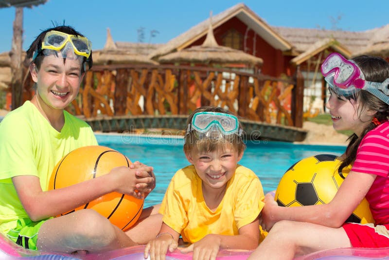 Three kids in the pool stock photo. Image of female, smile - 20340670