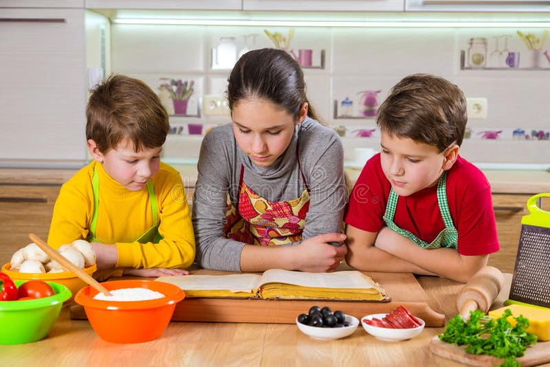 Three Kids Reading the Cook Book Stock Photo - Image of girl, caucasian ...
