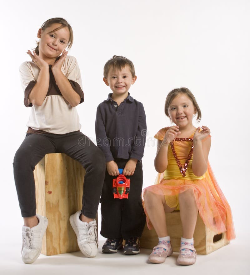 Three kids in a row stock image. Image of brother, boys - 7353199