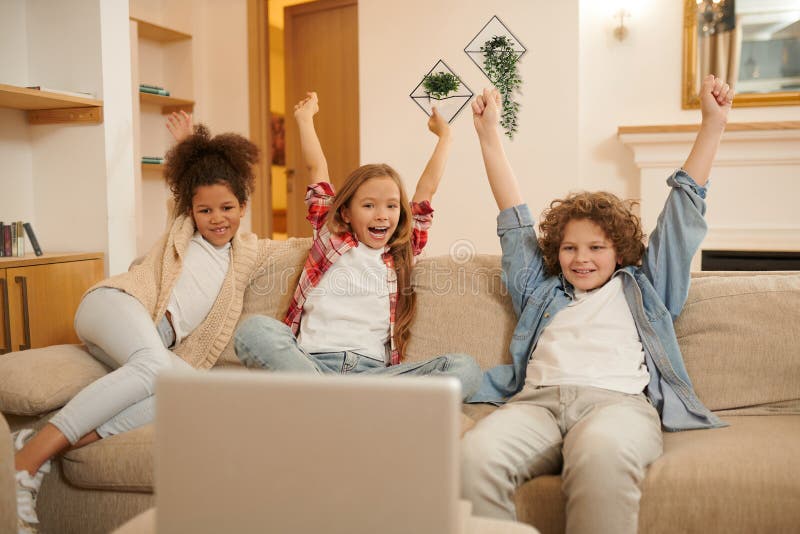 Three Kids Watching Something on a Laptop Stock Image - Image of teens ...
