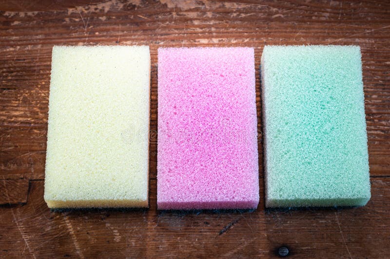 Three Kitchen Sponges on a Wooden Table Stock Image - Image of ...