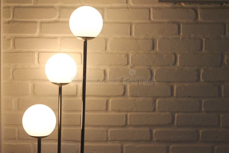Three lamp ball and wall stock photo. Image of white - 319886972