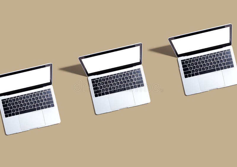 Three Laptop Computers with Shadow Stock Photo - Image of marketing ...