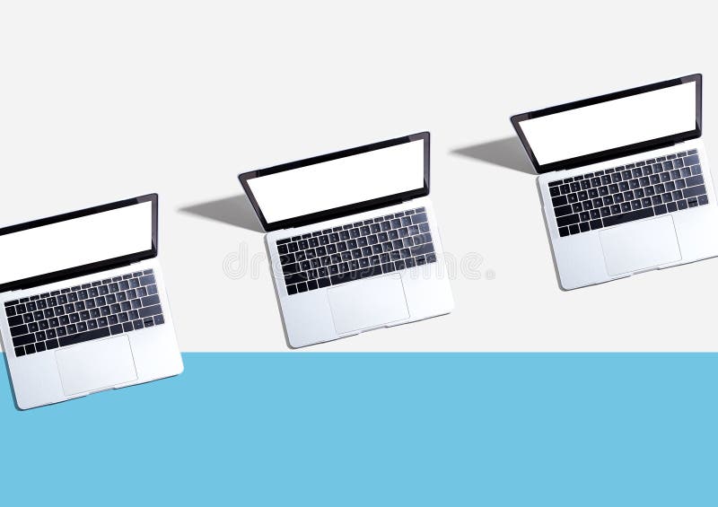 Three Laptop Computers with Shadow Stock Photo - Image of remote ...