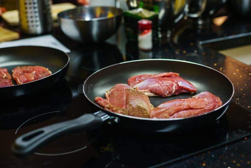 Three Large Fresh Piece of Meat in a Frying Pan. Stock Photo - Image of ...