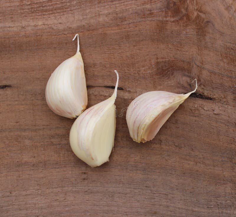 Three Large White Garlic Cloves Stock Photo - Image of cloves, hardy ...