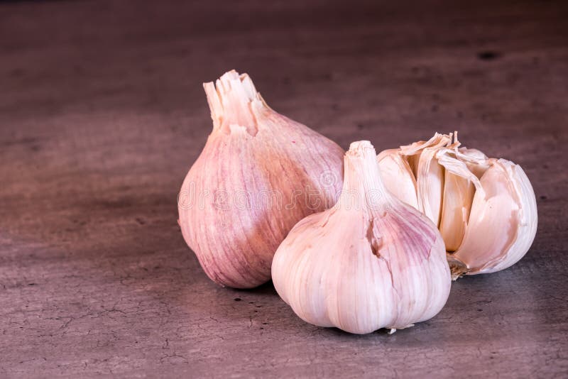 Three Large Heads of Pink Garlic on a Kitchen Worktop Stock Photo ...