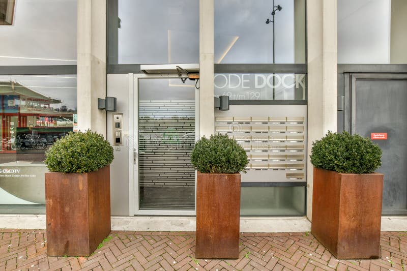 Three Large Planters in Front of an Office Building Editorial Stock ...
