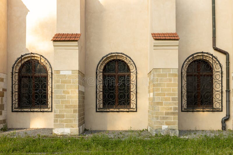 Three Large Windows with Traditional Iron Grille. Stock Photo - Image ...