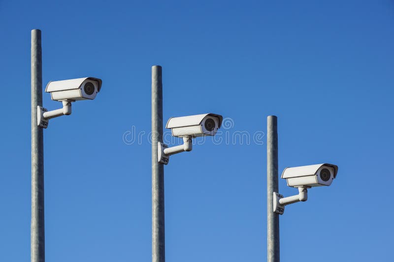Three Laterally Camera on a Post in Bue Sky Stock Image - Image of ...