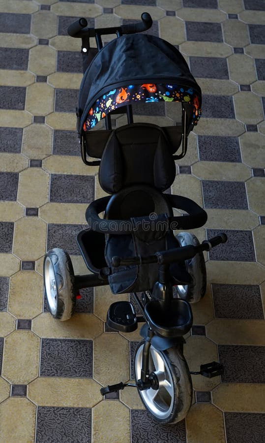 A Three-legged Baby Carriage Stock Photo - Image of toddler, walk ...