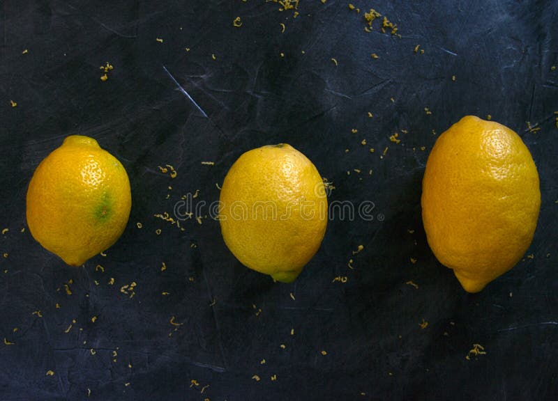 Three Lemons in Different Sizes Stock Photo - Image of green, table ...