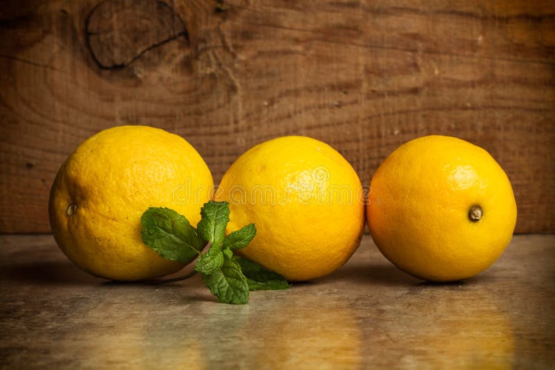 Three juicy lemons stock image. Image of eating, yellow - 13557139