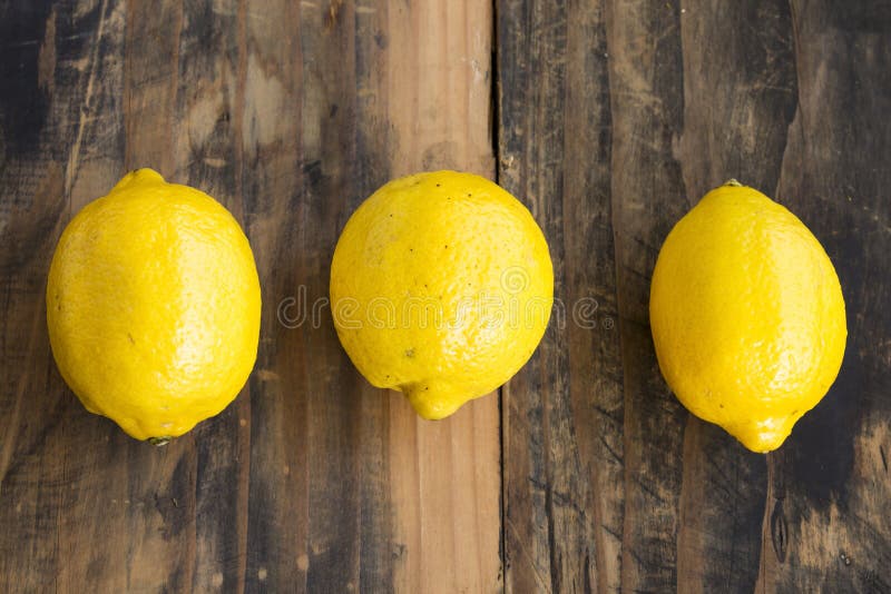 Three Lemons in a Olive Wood Bowl Stock Photo - Image of italy, wood ...