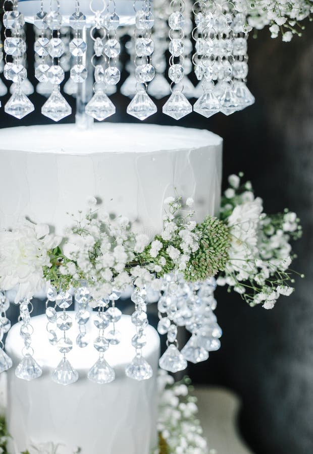 Three-level Wedding Cake on a Decorative Stand with Hanging Levels ...