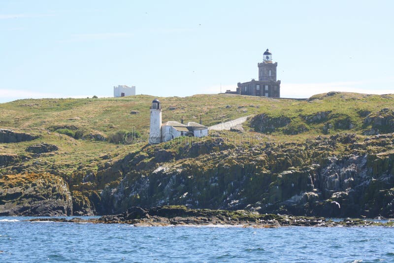 Three Lighthouses on Island Stock Image - Image of lighthouse, maritime ...