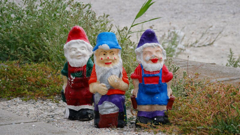 Three Little Ceramic Dwarfs Stock Photo - Image of three, outdoors ...