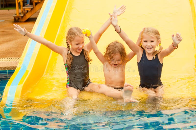 Three Little Kids Playing in the Swimming Pool Stock Image - Image of ...