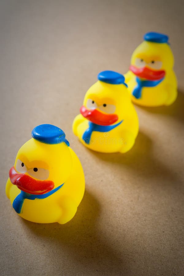 Three Little Yellow Rubber Duckling Stock Photo - Image of creative ...