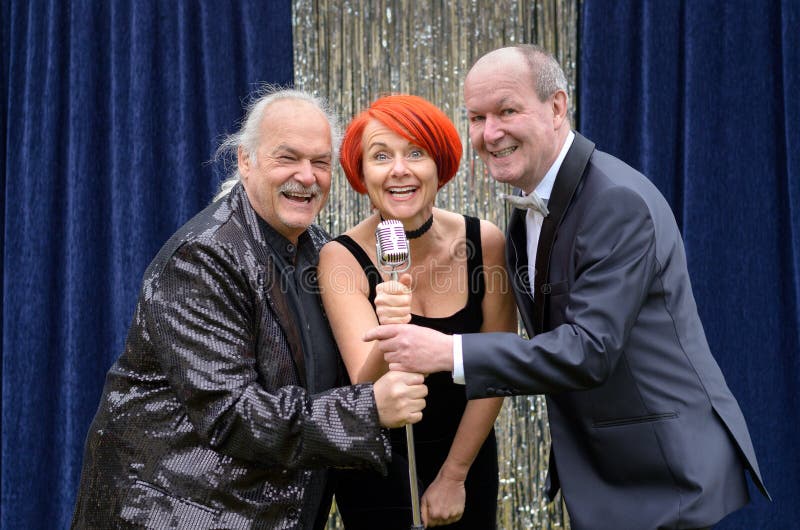 Three Lively Performers Having Fun on Stage Stock Photo - Image of ...