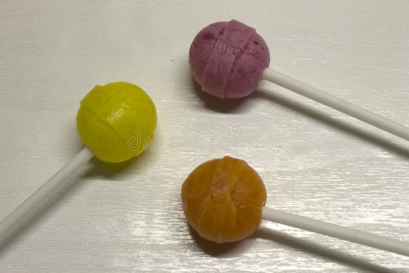 Three Lollipops stock image. Image of orange, suck, sweet - 12217
