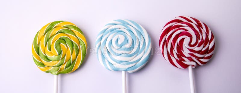 Three Lollipops on a White Background. Horizontal Banner Stock Photo ...