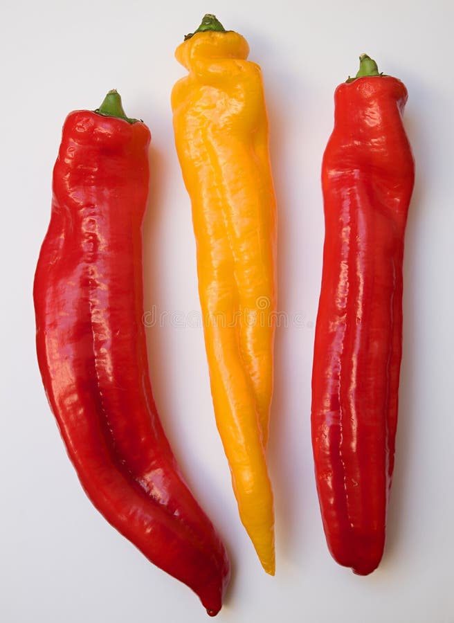 Three Long Peppers, Red and Yellow Stock Image - Image of peppers ...