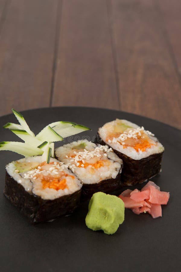 Three Maki Sushi Served in Black Round Plate Stock Photo - Image of ...