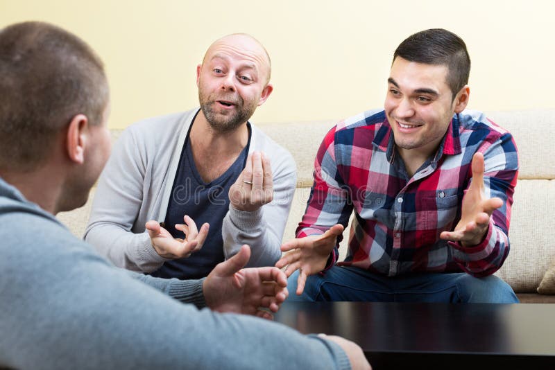 Three Male Friends Talking at Home Stock Photo - Image of house, people ...