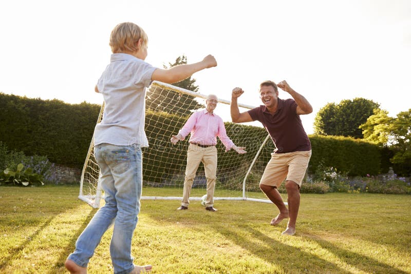 Three Male Generations of a Family Cheering in Garden Stock Image ...
