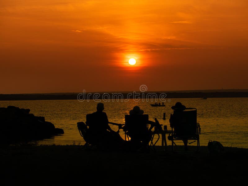 Three man under sunset stock image. Image of afterglow - 286475715