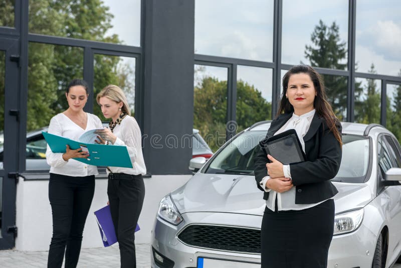 Three Managers with Folders Posing Outside Office Building Stock Image ...