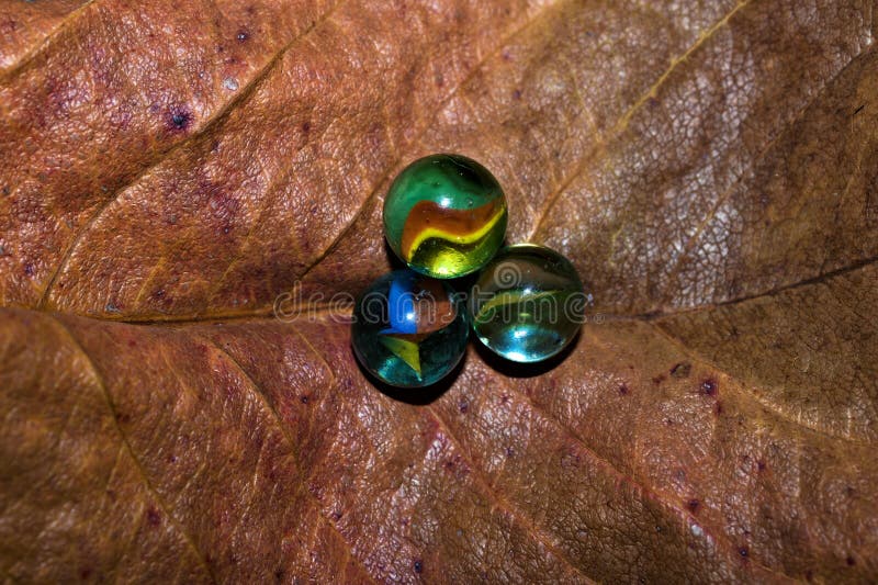 Three marbles stock image. Image of planet, marbles, yellow - 14640129