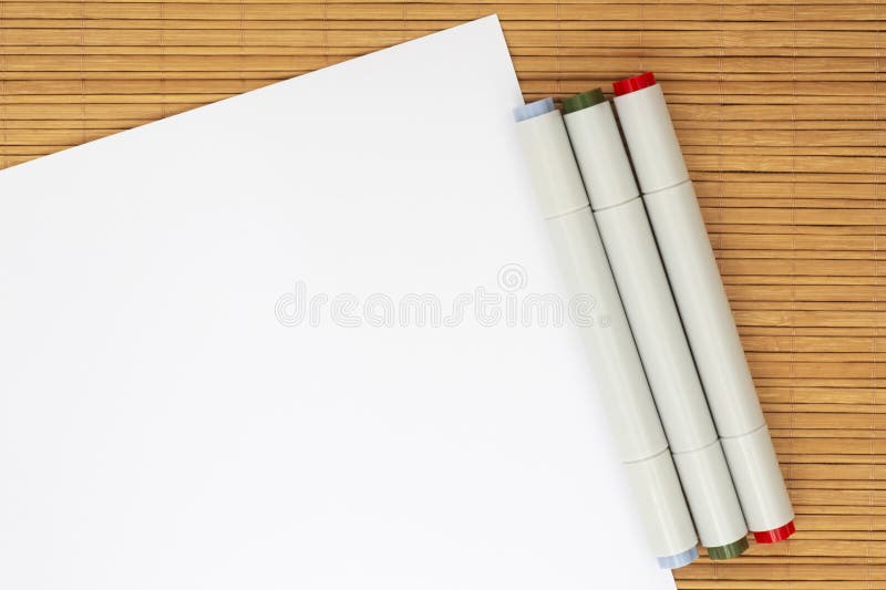 Three Markers for Sketching Laying at Sheet of White Paper on Bamboo ...