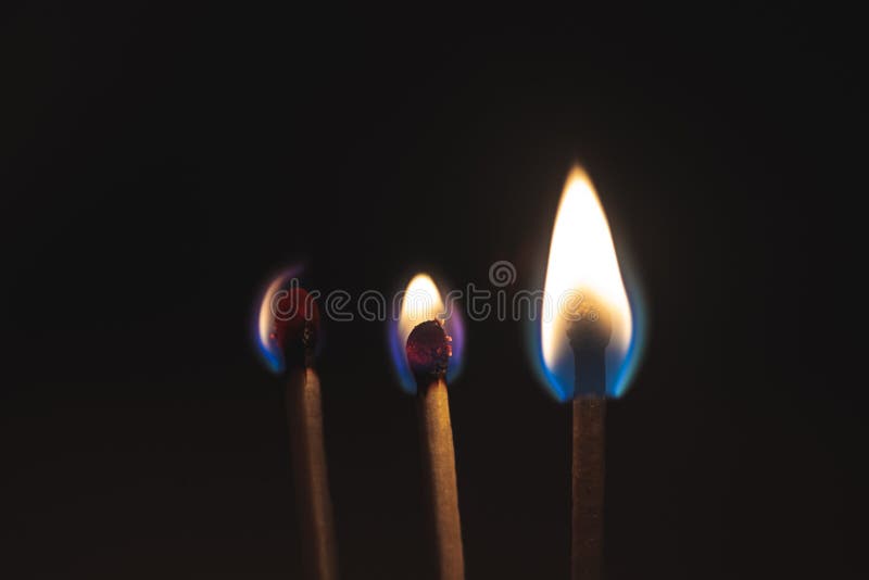 Three Matches Sticks Burning on a Black Background Stock Image - Image ...