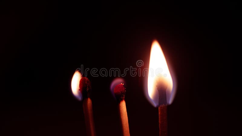 Three Matches Sticks Burning Together on a Black Background Stock Photo ...