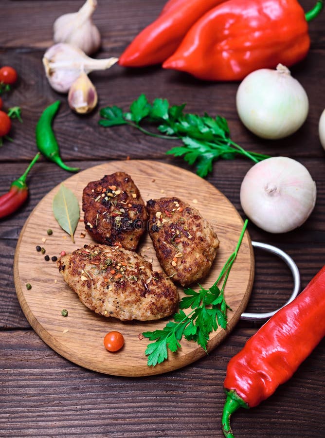 Three Meat Cutlets with Spices Stock Photo - Image of board, fresh ...