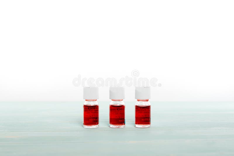 Three Medicine Vials Filled with Red Liquid Stock Photo - Image of ...