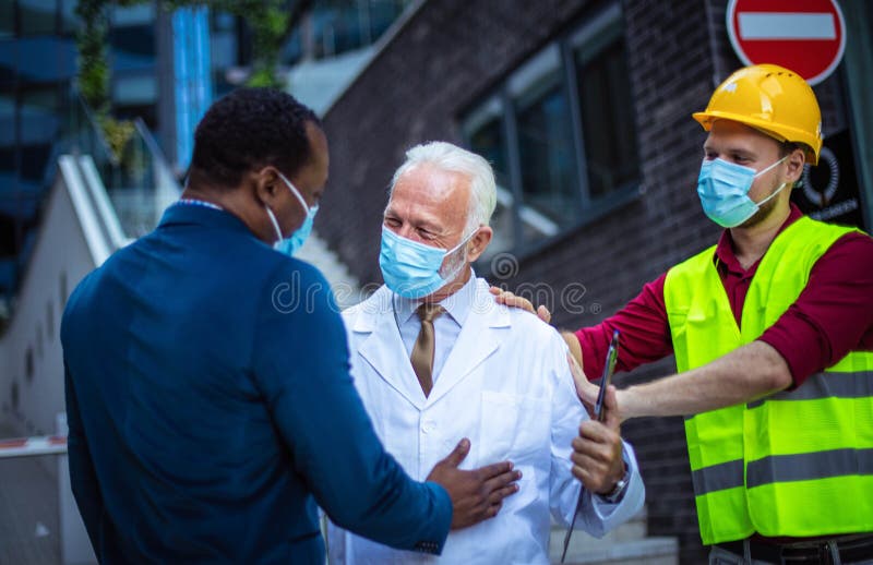Doctor, a Business Man and an Engineer Talking on the Street Stock ...