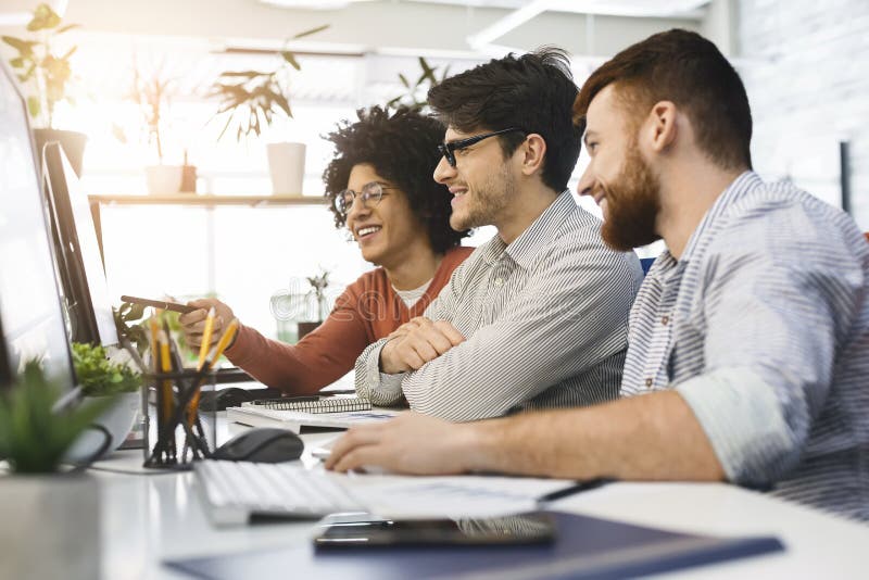 Three Men Enjoying Good Coding Job on Computer at Modern Office Stock ...