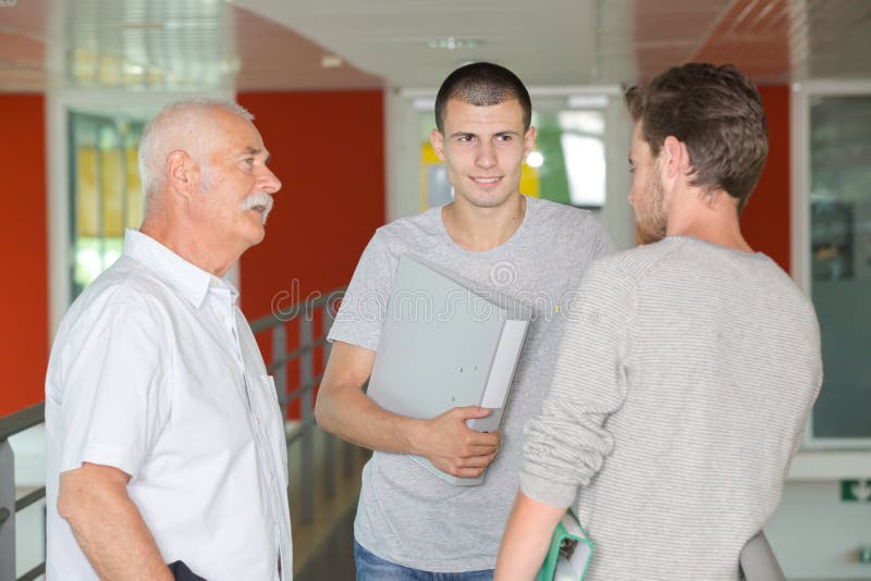 Three Men Having Casual Conversation Stock Photo - Image of classmate ...