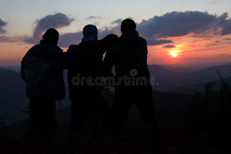 The Three Hikers Walk Trip, in the Top of the Sunset Stock Photo ...