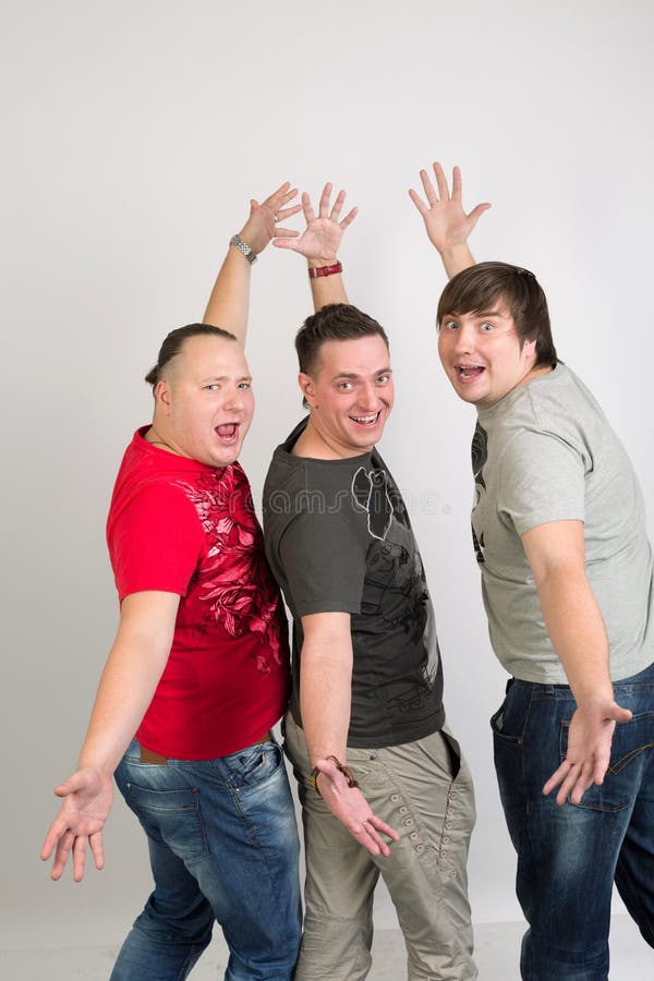 Three Men in T-shirts and Jeans Stock Photo - Image of person, clothing ...